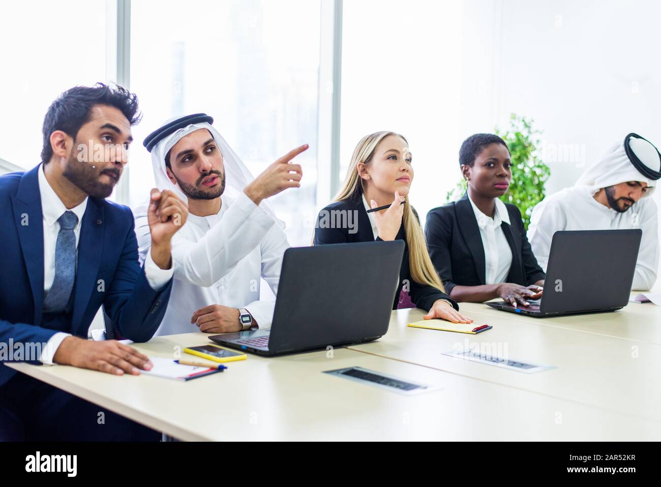 Multiracial group of business people having a meeting in a office ...