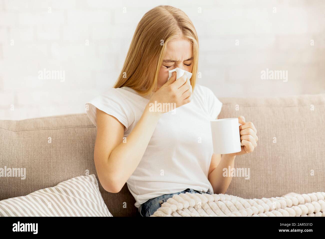 Sick Girl with Fever Drinking Hot Tea Stock Photo - Alamy