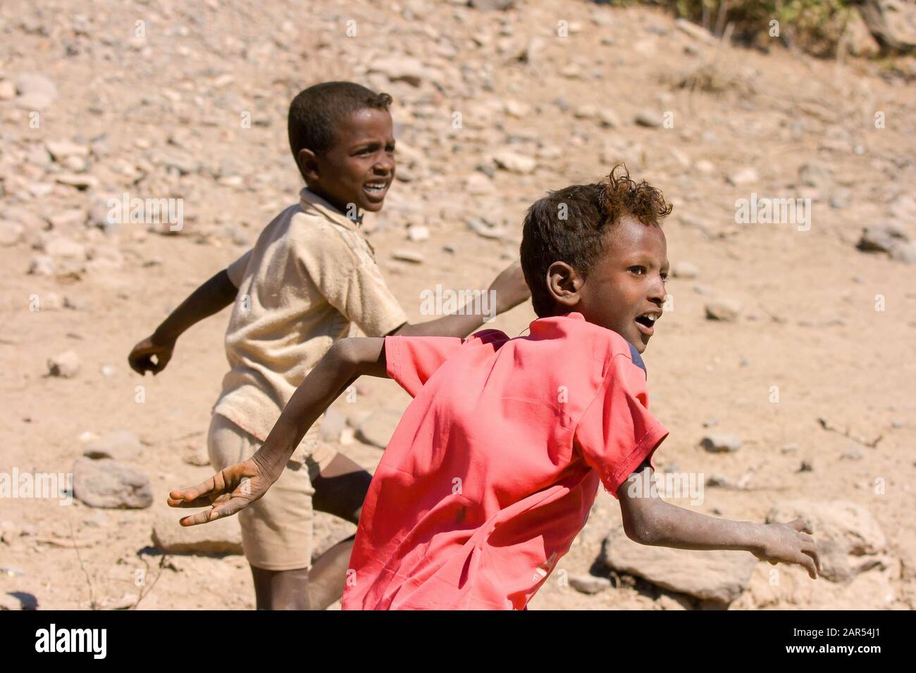 Young Afar boys running and playing, Afar region, Ethiopia. The ...