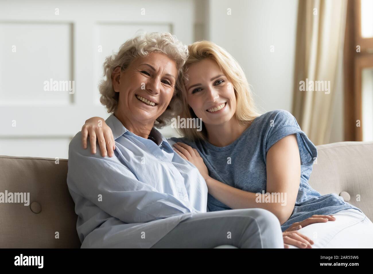 Portrait of happy bonding female two generations family Stock Photo - Alamy