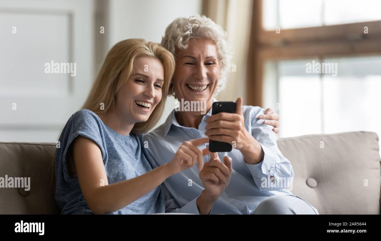 Happy two generations family making selfie on cellphone Stock Photo - Alamy