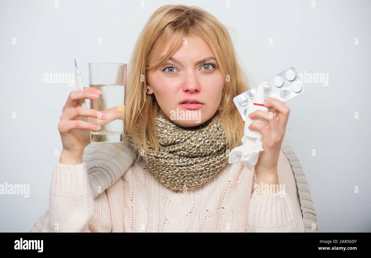 Following drug dosage regime. Sick girl taking anti cold pills. Ill ...