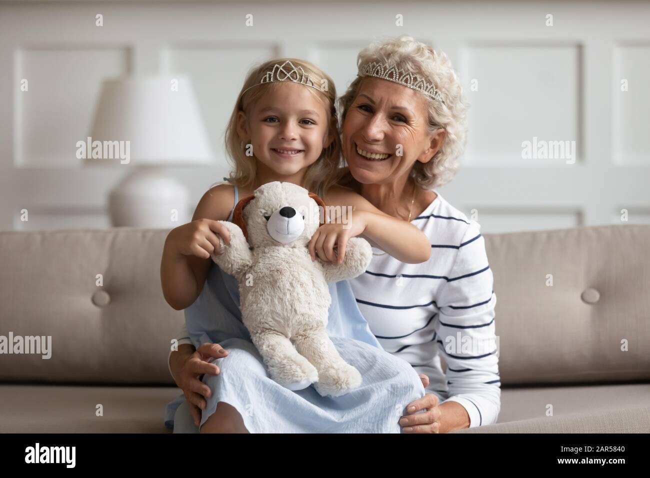 Different generations female family wearing crowns, portrait Stock ...