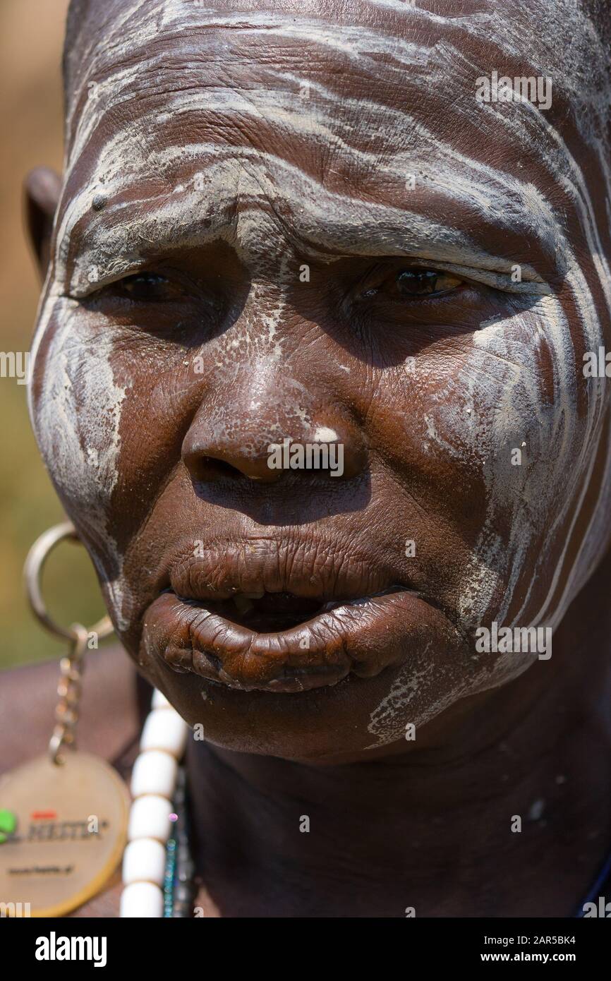Portrait of old Mursi woman. The Mursi women are famous of wearing ...