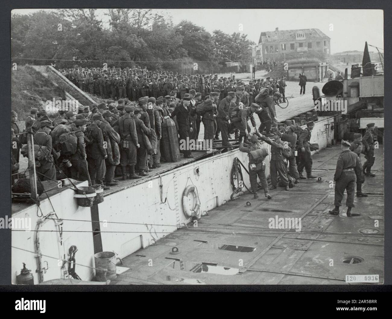 In Den Helder the disarmed German soldiers are embarked in LCT boats ...