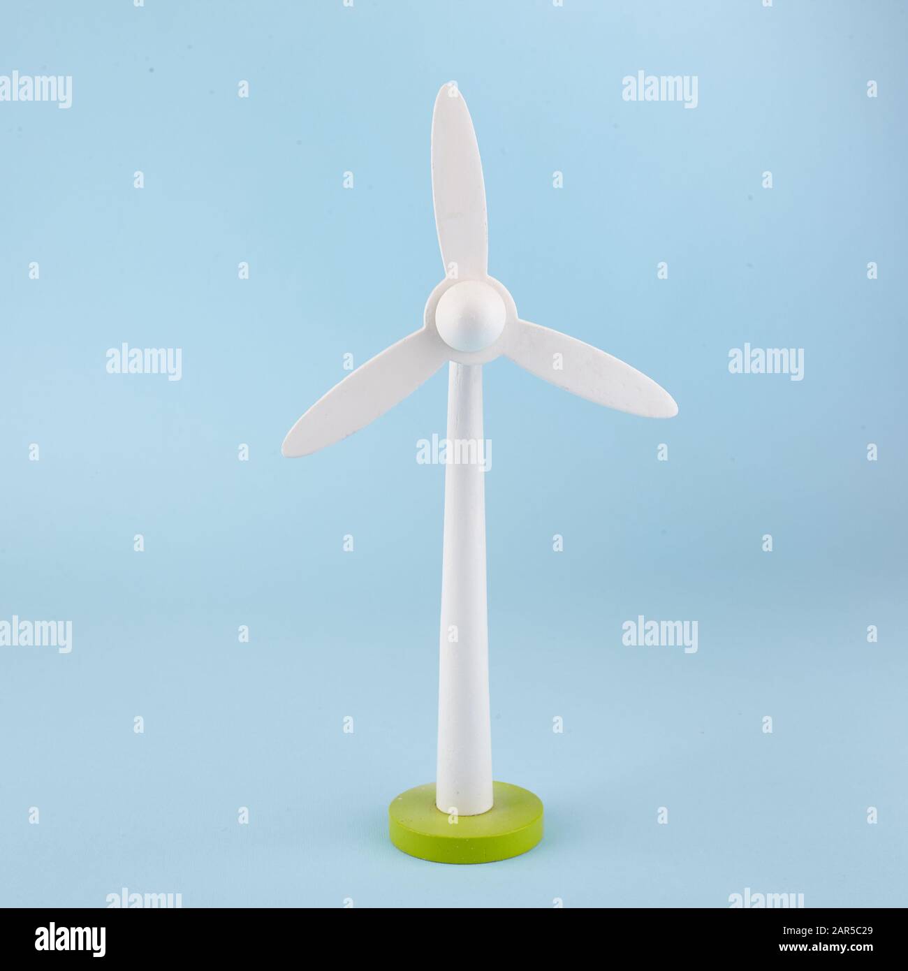 wind turbine wooden toy or light blue background, eco concept Stock ...