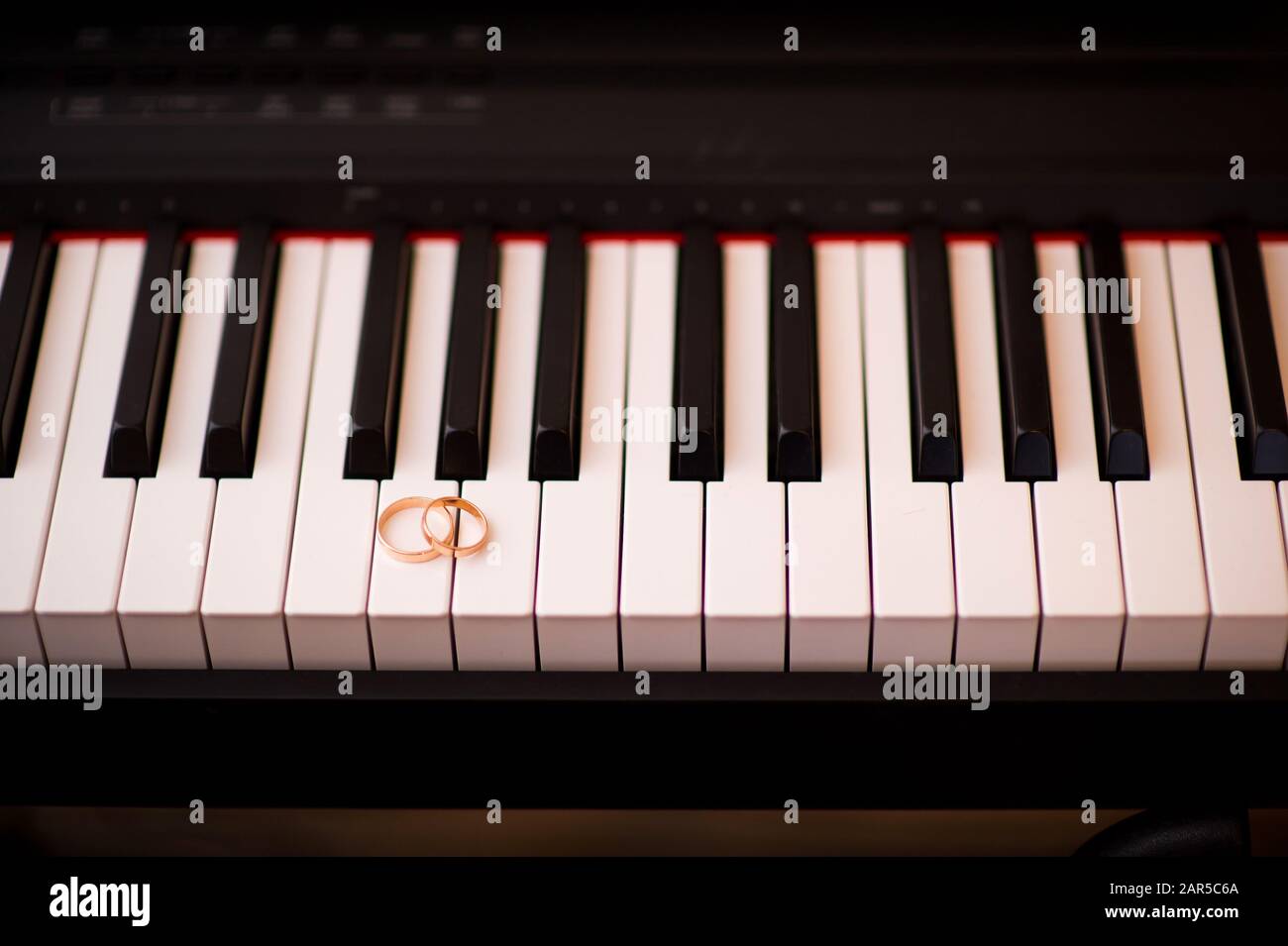 Wedding rings on piano hi-res stock photography and images - Alamy