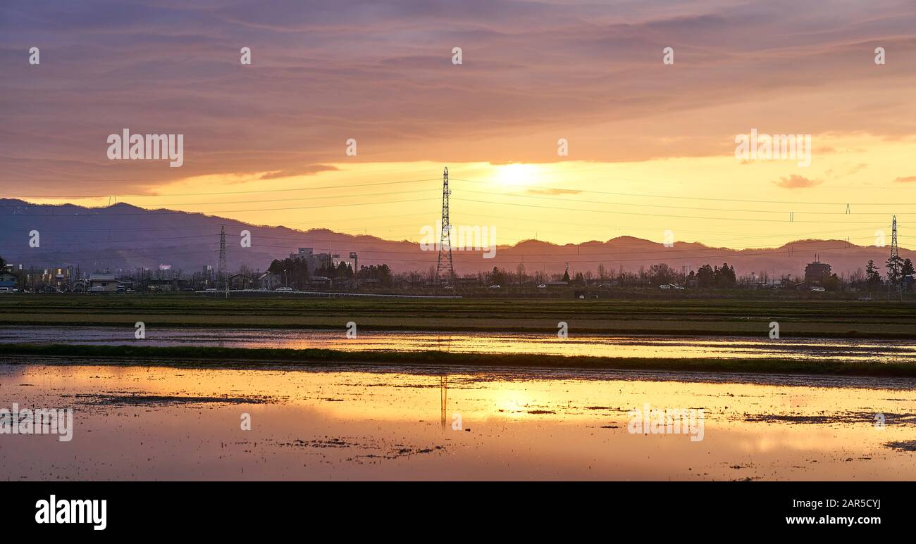 Bright orange sunset in Niigata, Japan, in early spring, before the ...