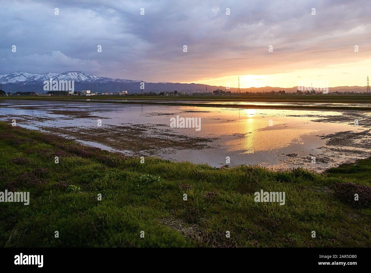 Bright orange sunset in Niigata, Japan, in early spring, before the ...