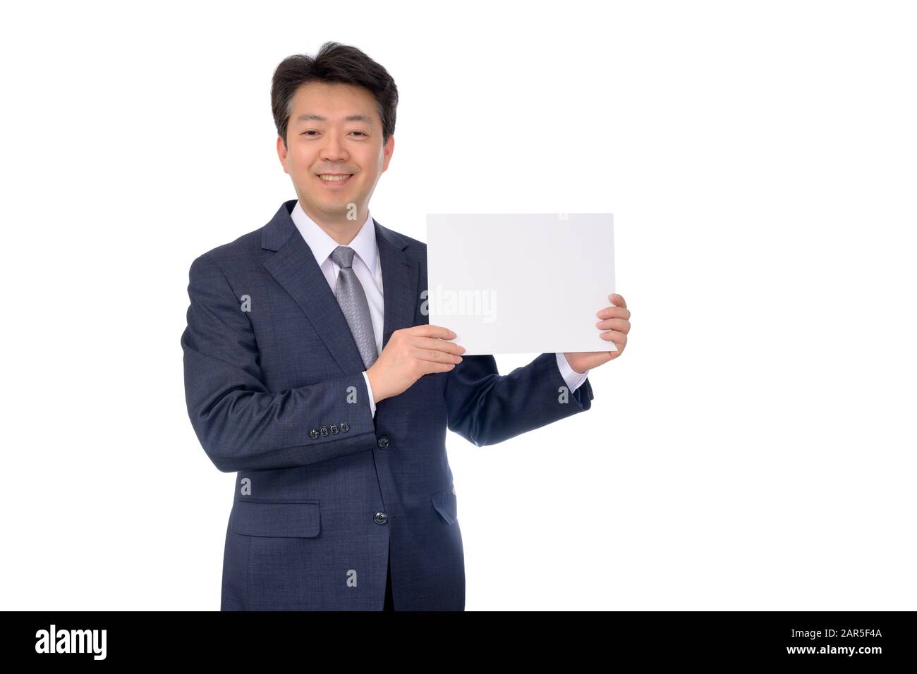 Portrait of Asian businessman holding blank message board Stock Photo ...