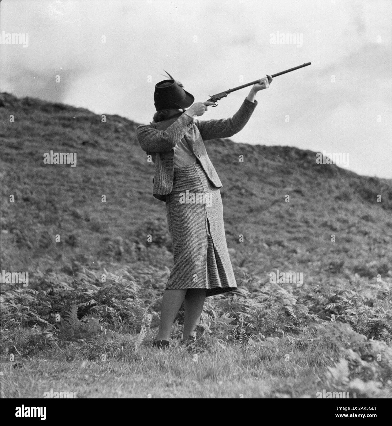 Grouse hunting on Skye Hunting. Woman shooting with a shotgun on the ...