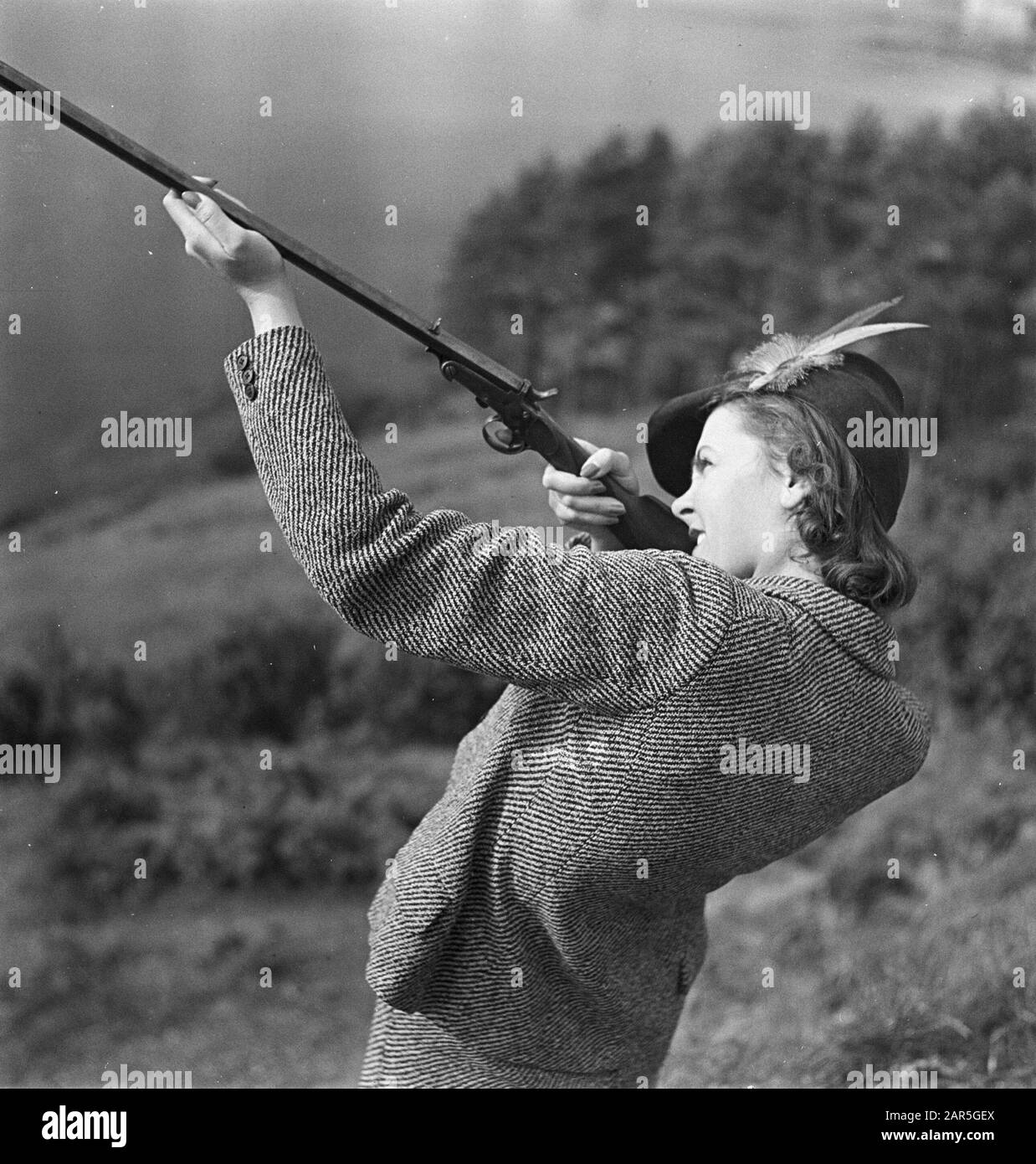 Grouse hunting on Skye Hunting. Woman shooting with a shotgun on the ...