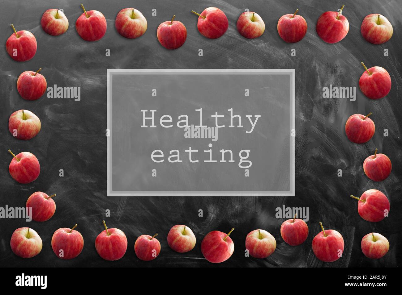 HEALTHY EATING text front page title on black billboard and apple ...