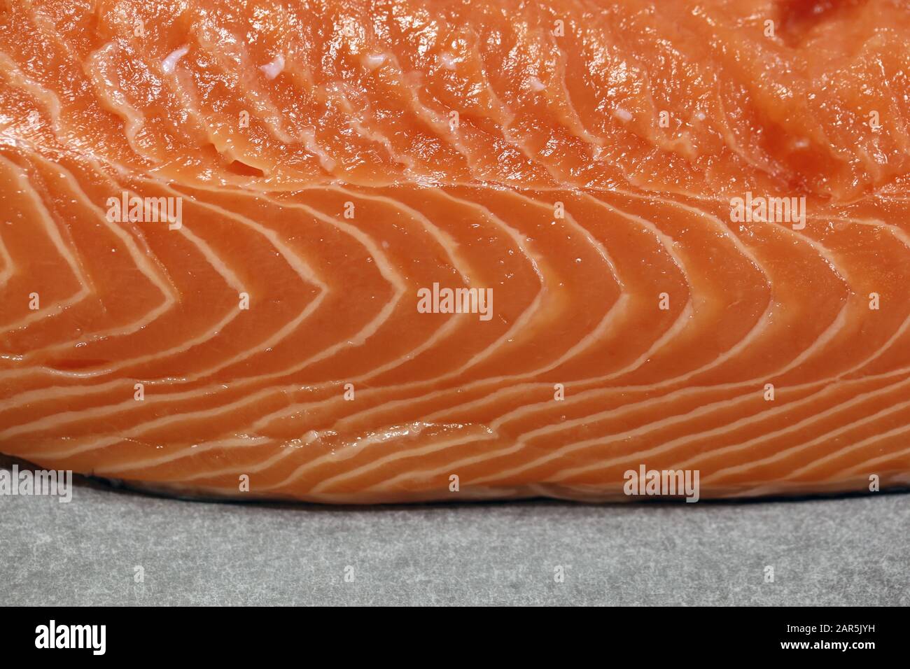 Norwegian salmon fillet in a closeup. Beautiful red color and texture ...