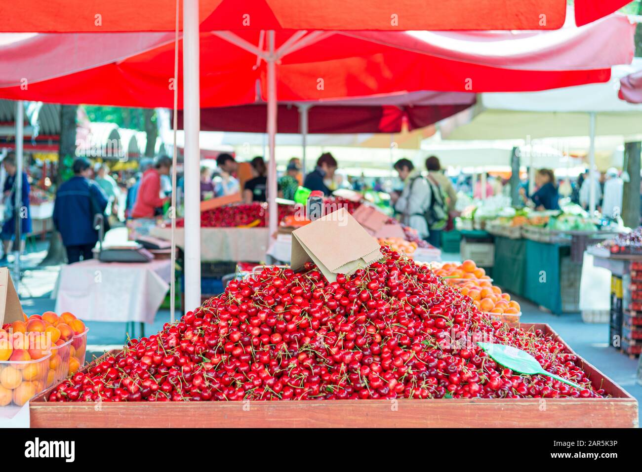 Fruitstand at open market selling fresh cherries Stock Photo - Alamy
