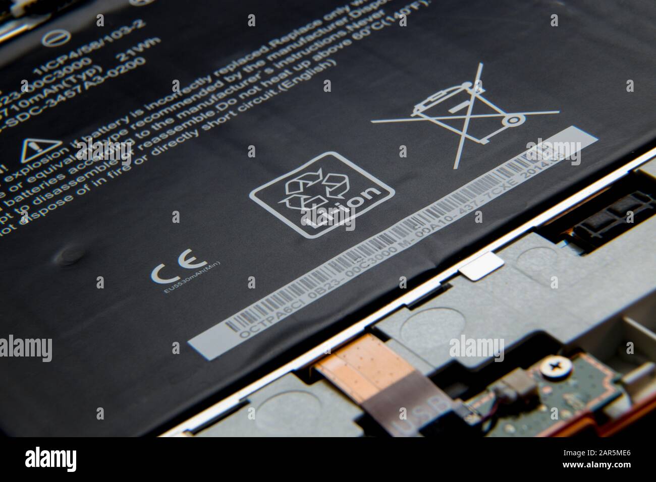 Li ion battery in an old Android tablet Stock Photo - Alamy