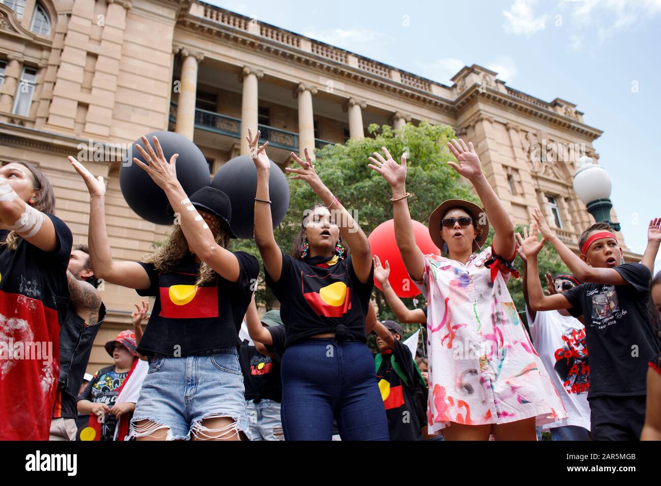 Indigenous protesters take part in a traditional dance at Queens ...