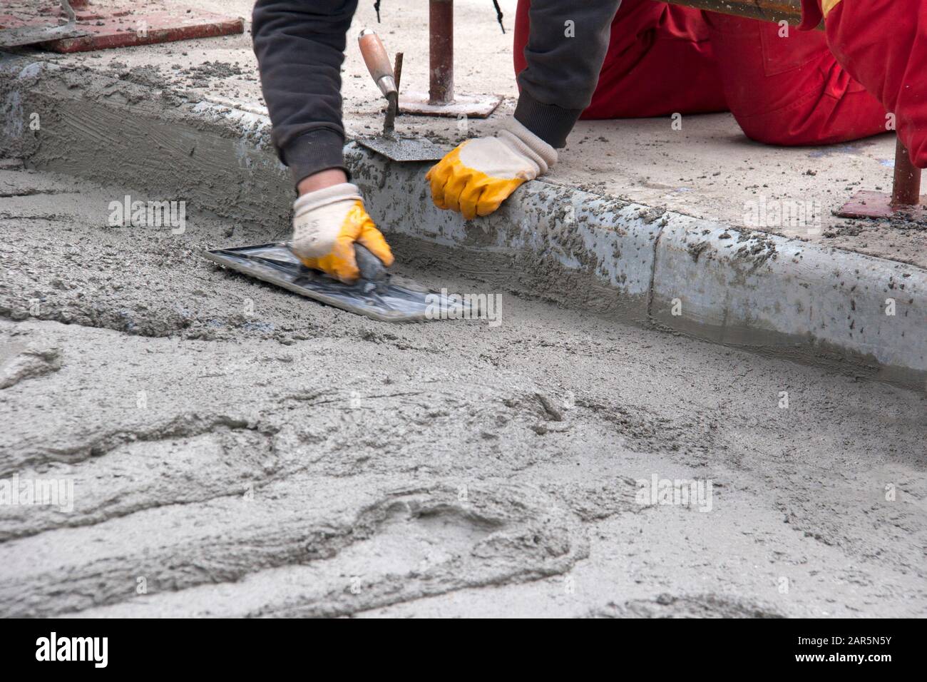 Spreading concrete hi-res stock photography and images - Alamy