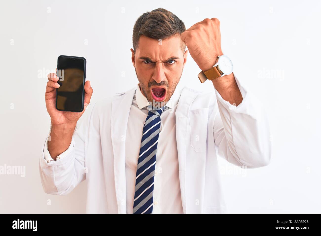 Young scientist man showing smartphone screen over isolated background ...