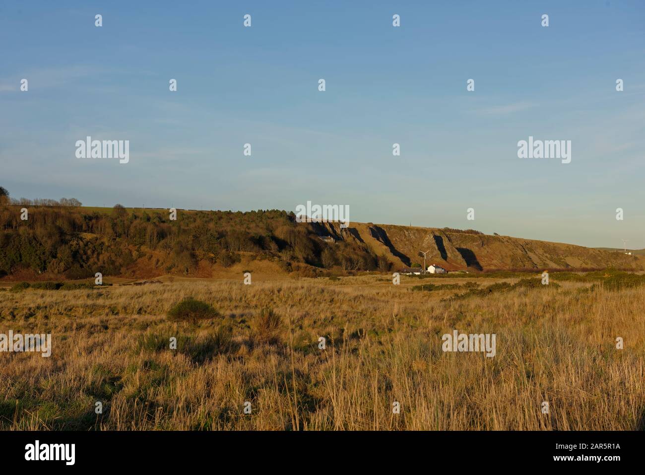 The Cliffs behind St Cyrus Beach with the white painted buildings of ...