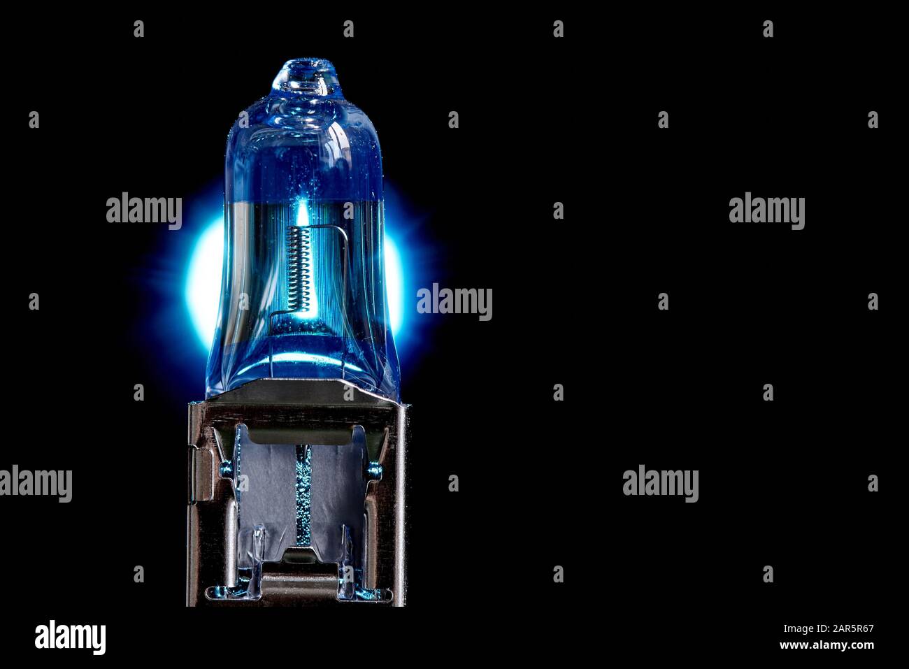 Spare light bulb for a car's headlights on black background.Сopy space ...