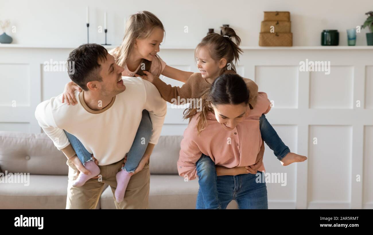 Small girl kids piggyback parents playing at home Stock Photo - Alamy Small girl kids piggyback parents playing at home Stock Photo - Alamy