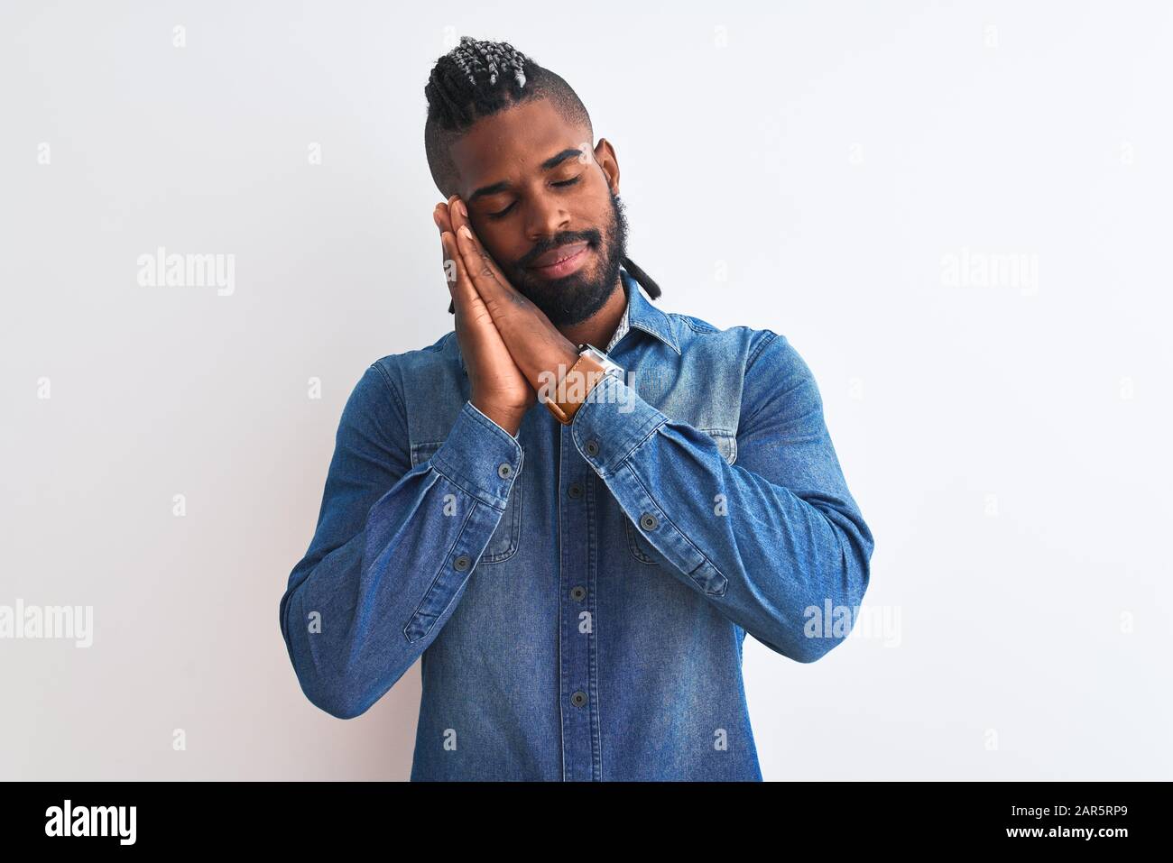 African american man with braids wearing denim shirt over isolated ...