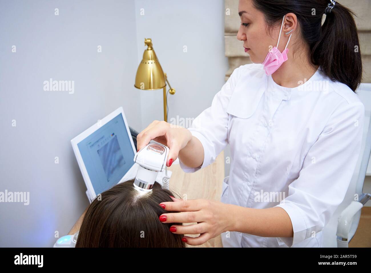 Diagnostic microscopic examination of hair and scalp Stock Photo - Alamy