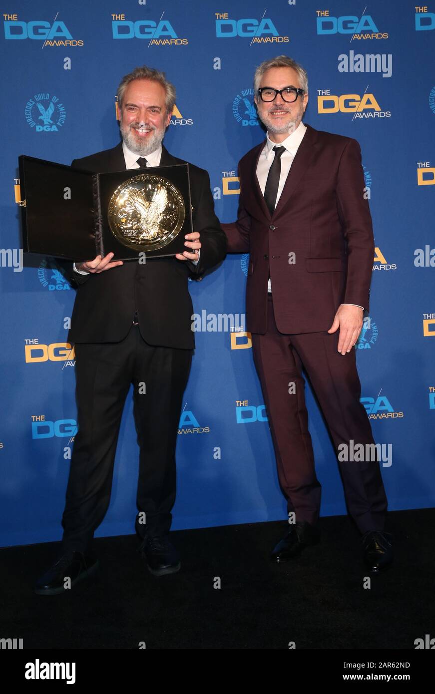 LOS ANGELES, CA - JANUARY 25: Sam Mendes, Alfonso Cuarón, at the 72nd ...