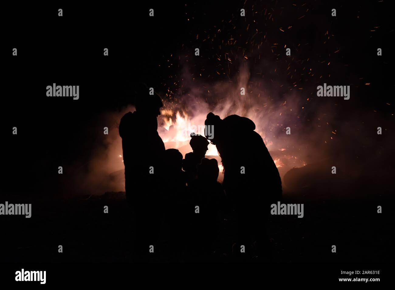 Villagers seen next to a bonfire during the celebration.The small ...