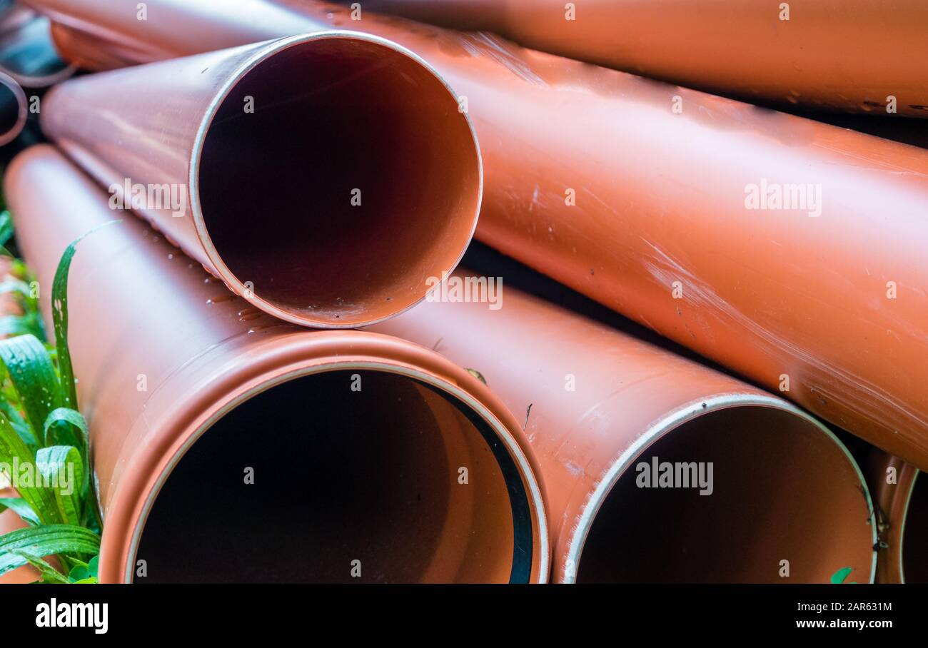 canal pipes on a construction site background Stock Photo - Alamy