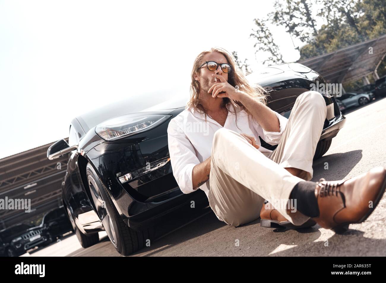 Man smoking car hi-res stock photography and images - Alamy