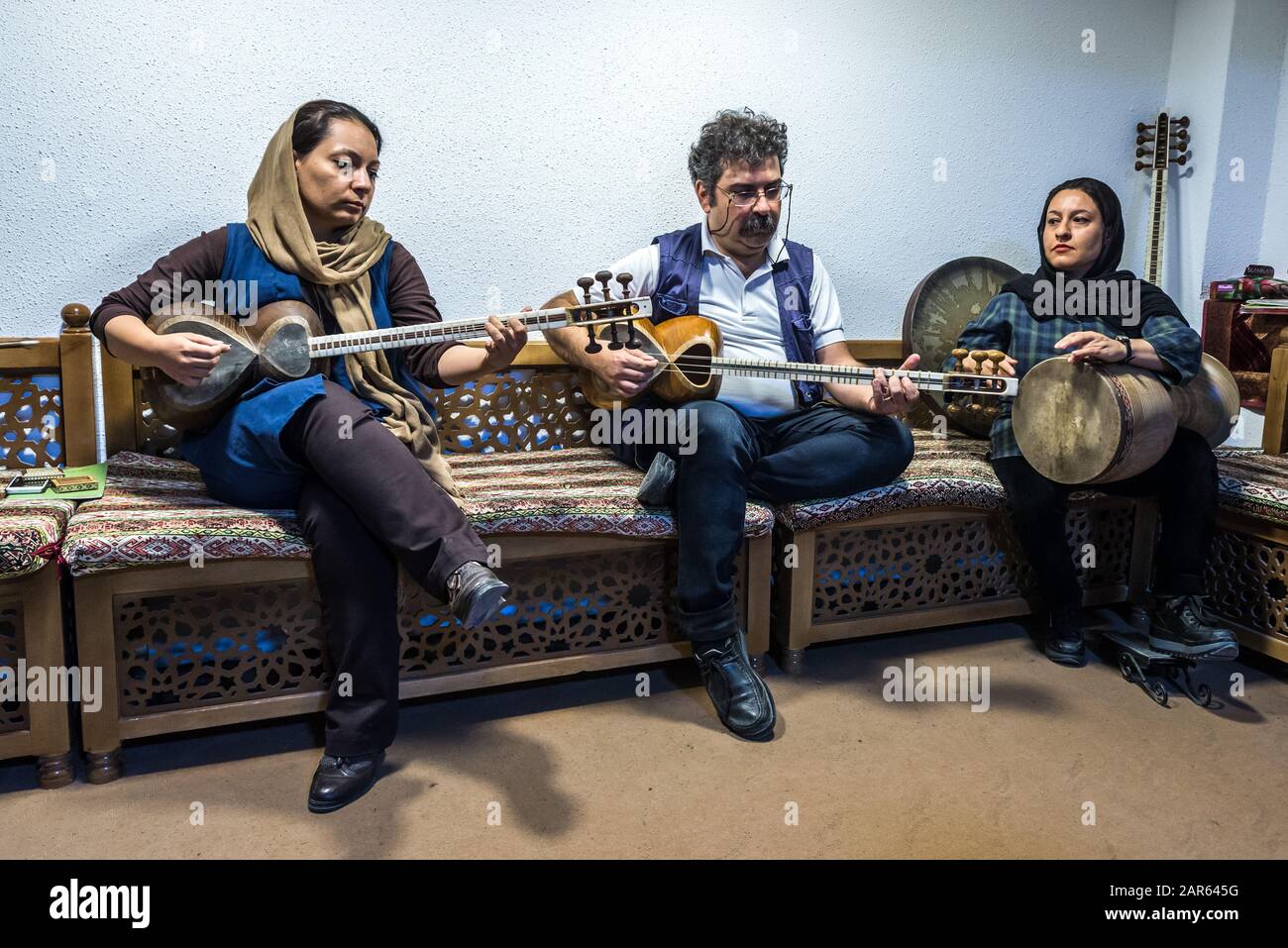 Iranians playing on traditional instruments during concert for tourist ...