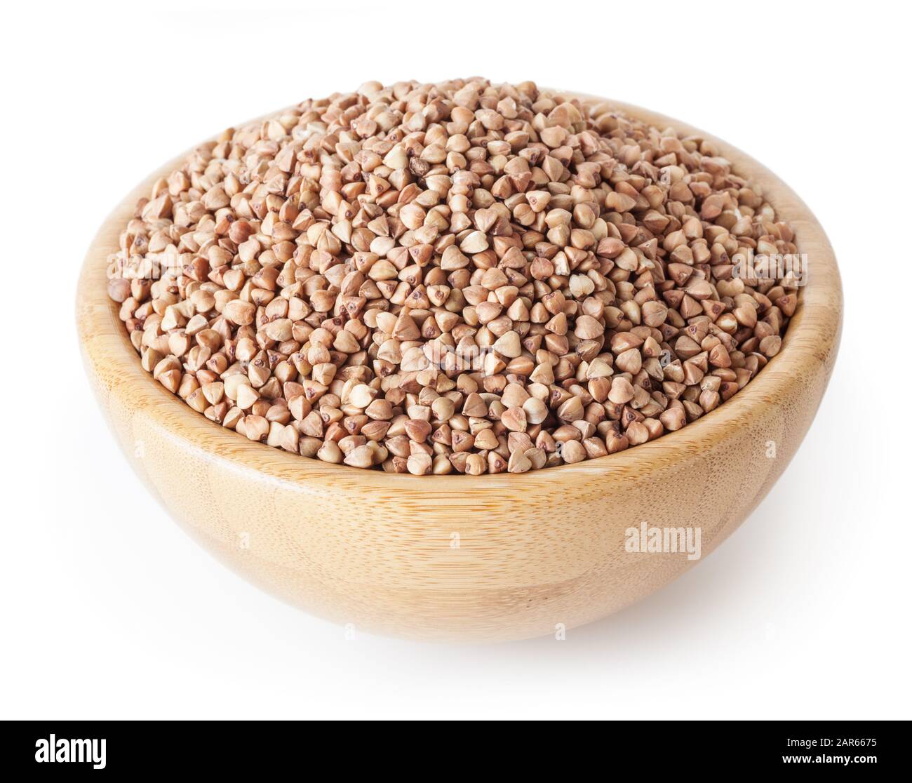 Roasted buckwheat grains in wooden bowl isolated on white background ...