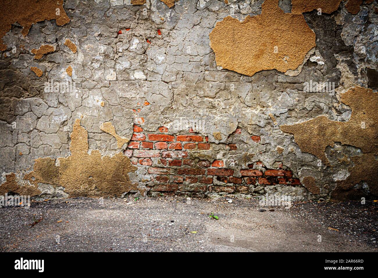 Old weathered wall of plaster and bricks and a ground Stock Photo - Alamy