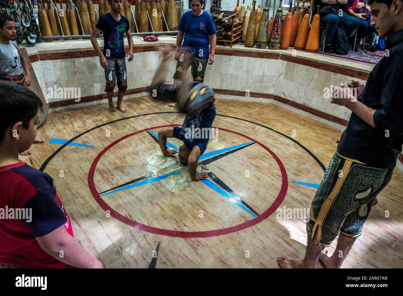Iranian men and boys training in Zoorkhaneh (House of Strength ...