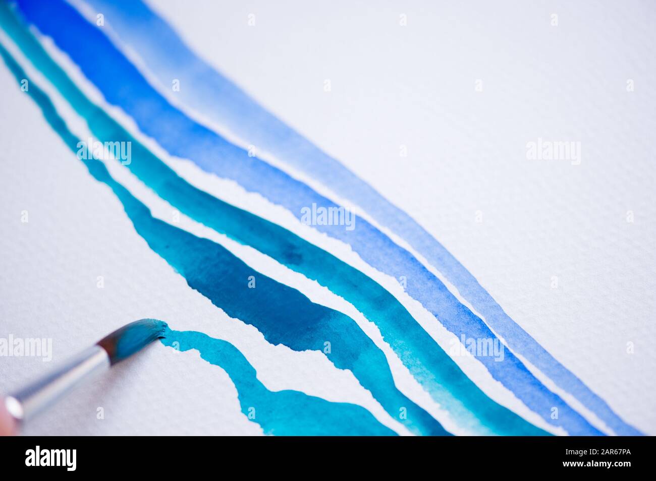 Painting with paintbrush on watercolor paper Stock Photo - Alamy