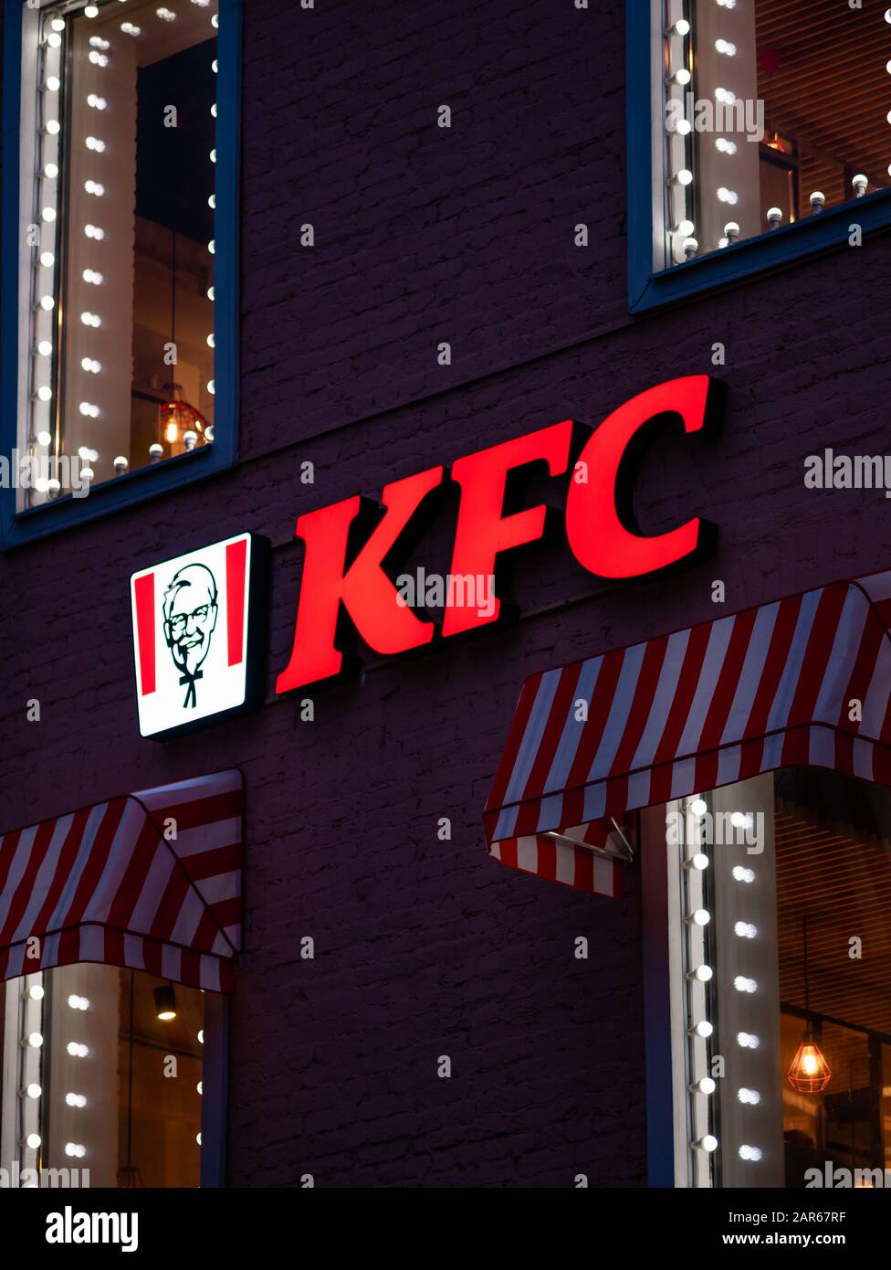 Moscow, Russia - January 17, 2020: KFC logo with red lights on wall of ...