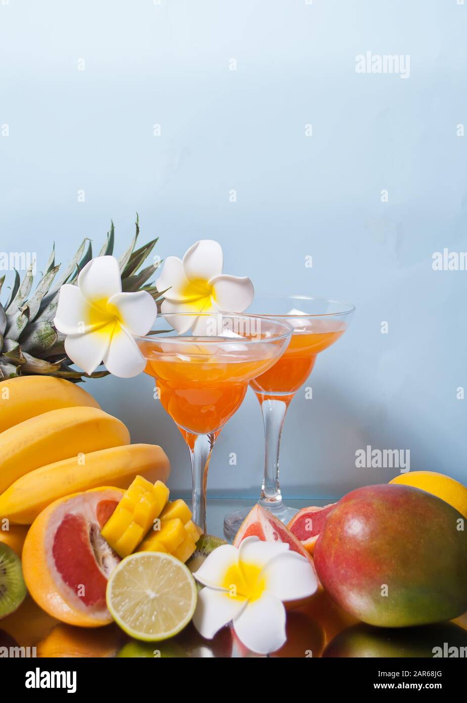 Glasses of tropical exotic multifruit juice cocktails drink with ...
