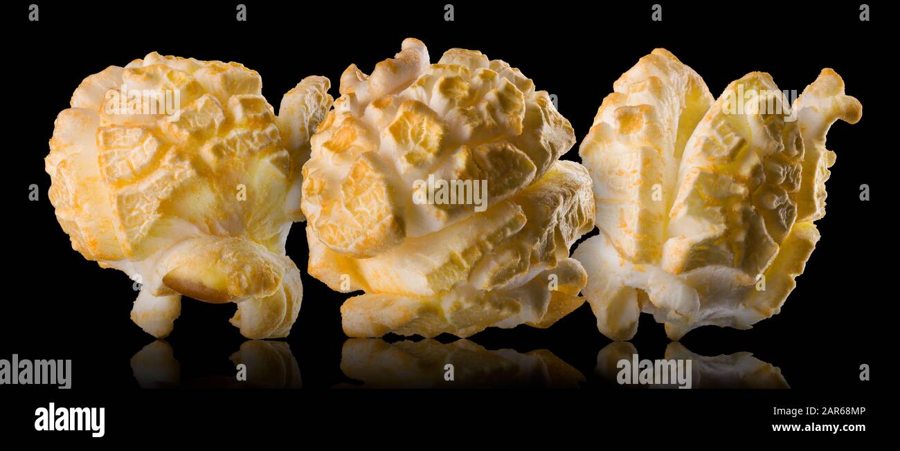 Set of popped popcorn on a black background Stock Photo - Alamy