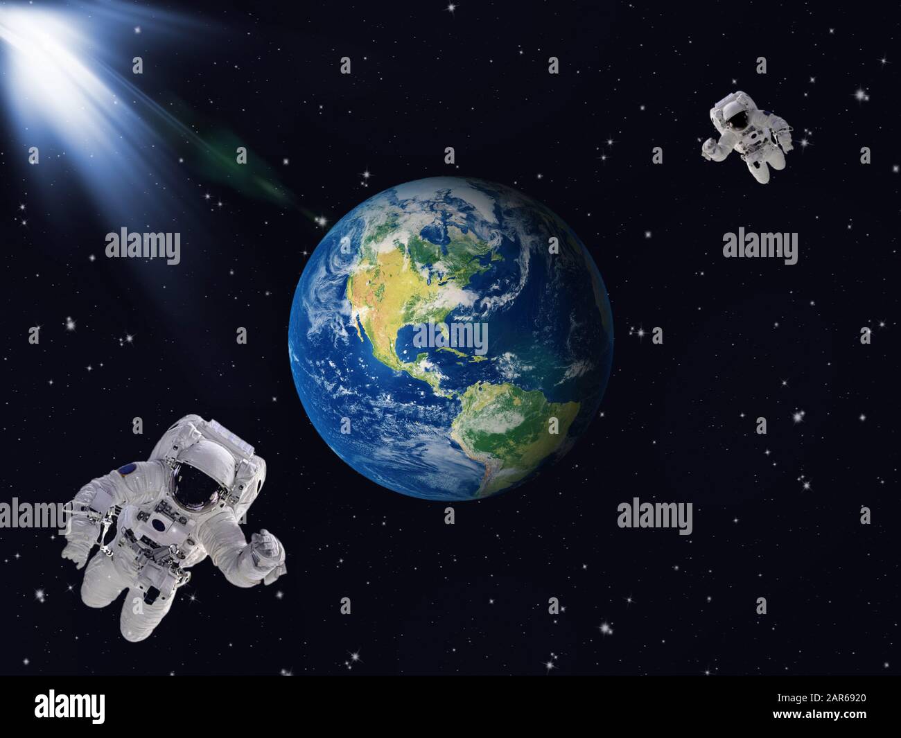 Two astronauts in outer space with Planet Earth. Elements of this image ...