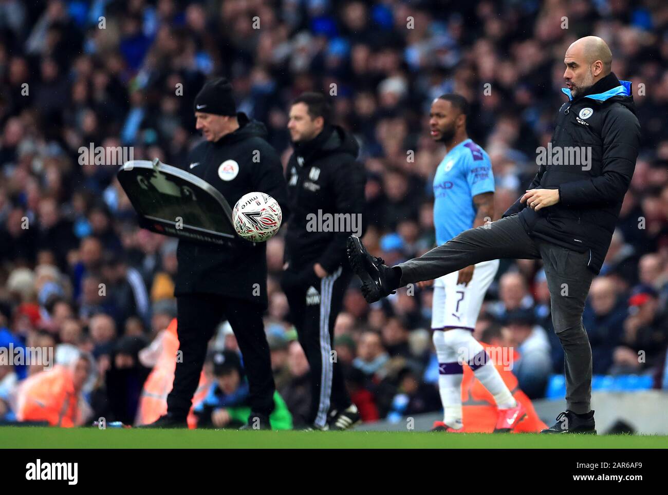 Manchester city manager pep guardiola kicks ball hi-res stock ...