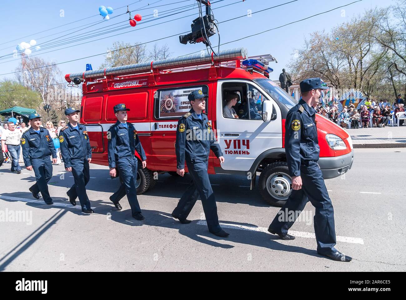 Employees and car of fire department on parade Stock Photo - Alamy