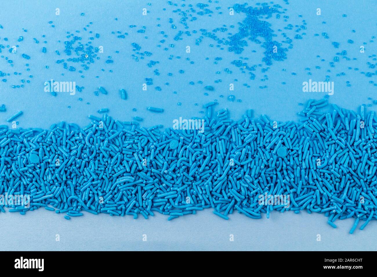 Abstract sprinkle background with blue colored cake topping sprinkles ...