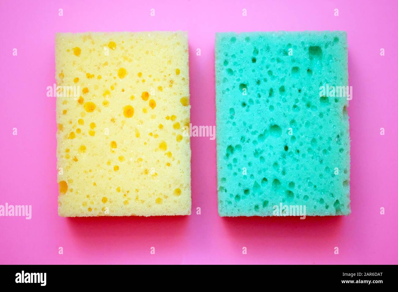 Green and yellow foam sponge for washing dishes. Soft washcloths on a ...