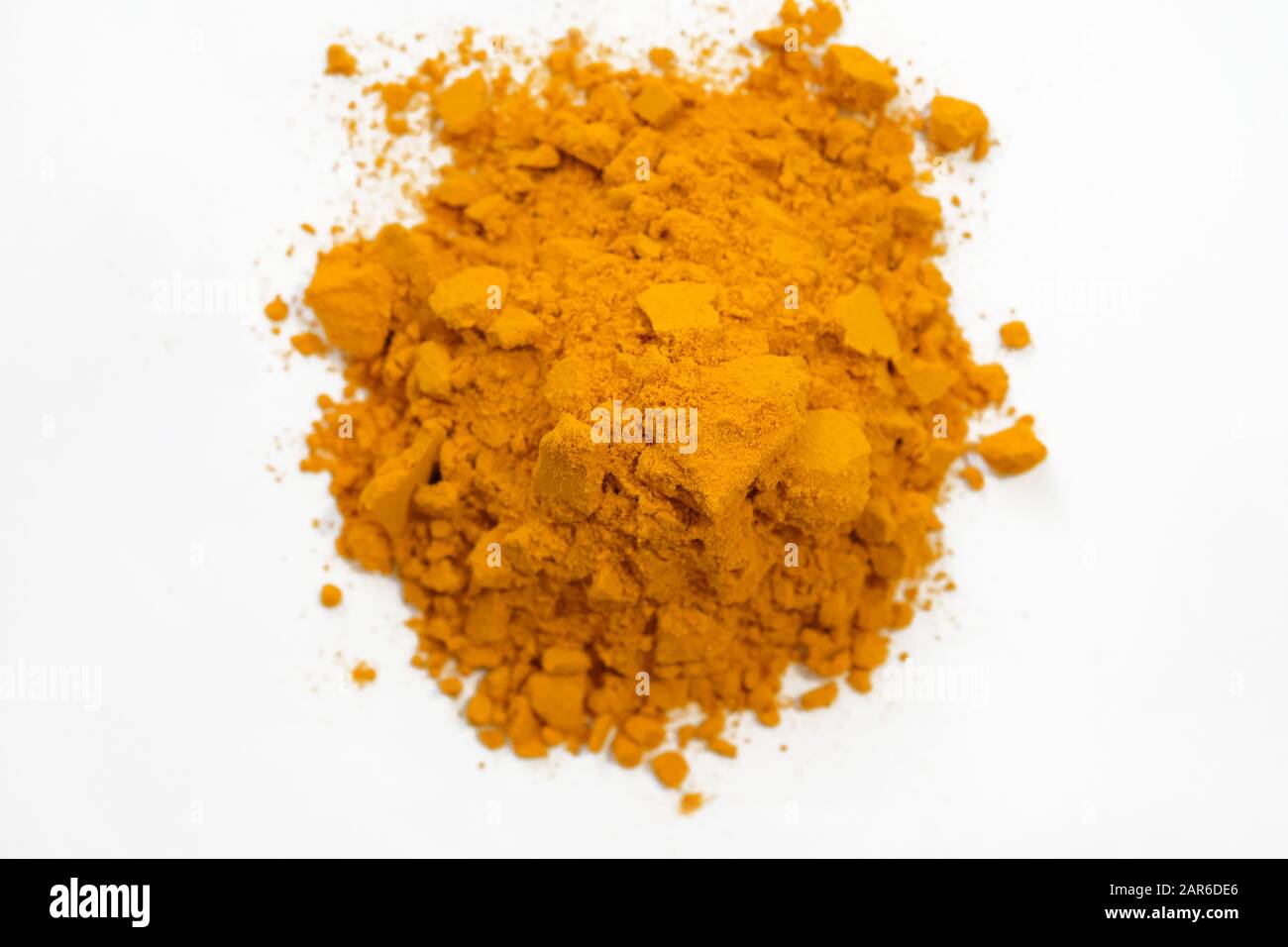 Yellow turmeric root powder on a white background. Spice for cooking ...