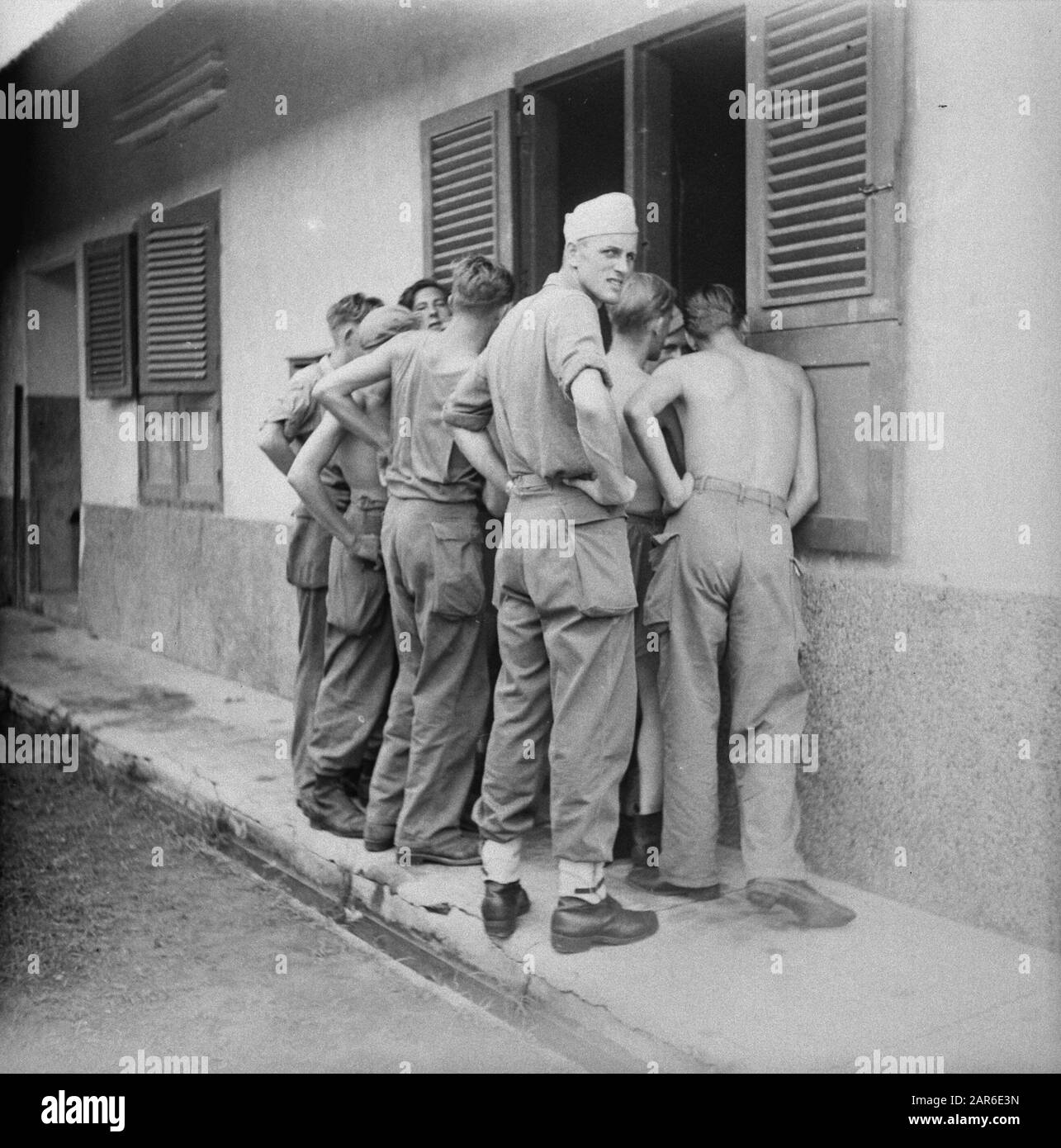 Post for the X- Brigade Staff standing in front of a window Date ...