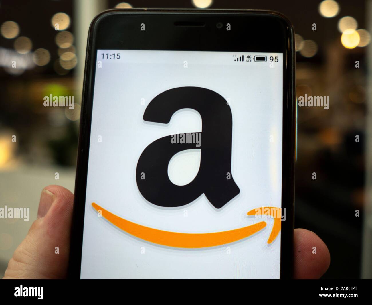 In this photo illustration the Amazon logo is seen displayed on a ...