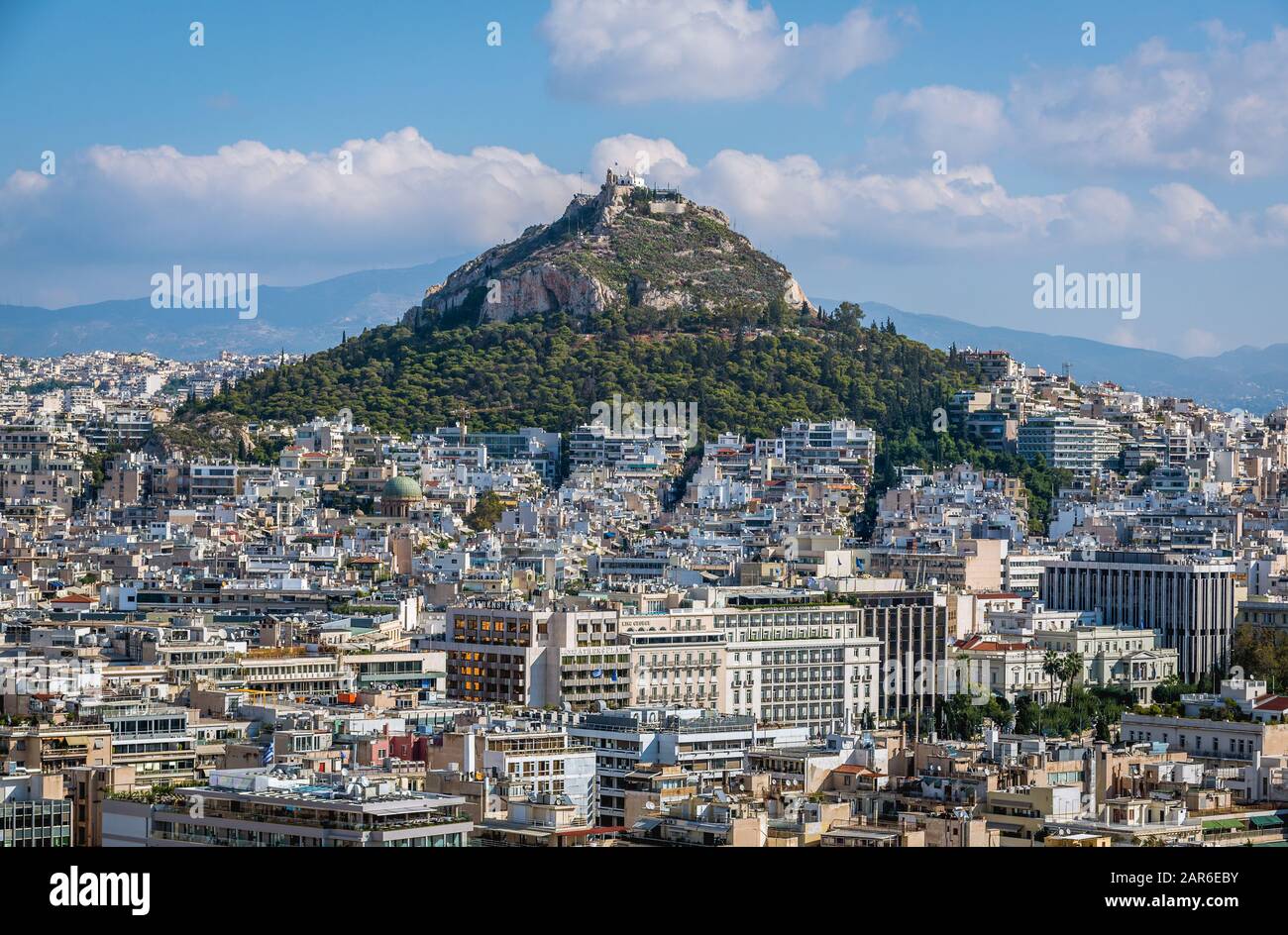 Aerial view from Acropolis of Athens city, Greece. Mount Lycabettus with Church of St George ...