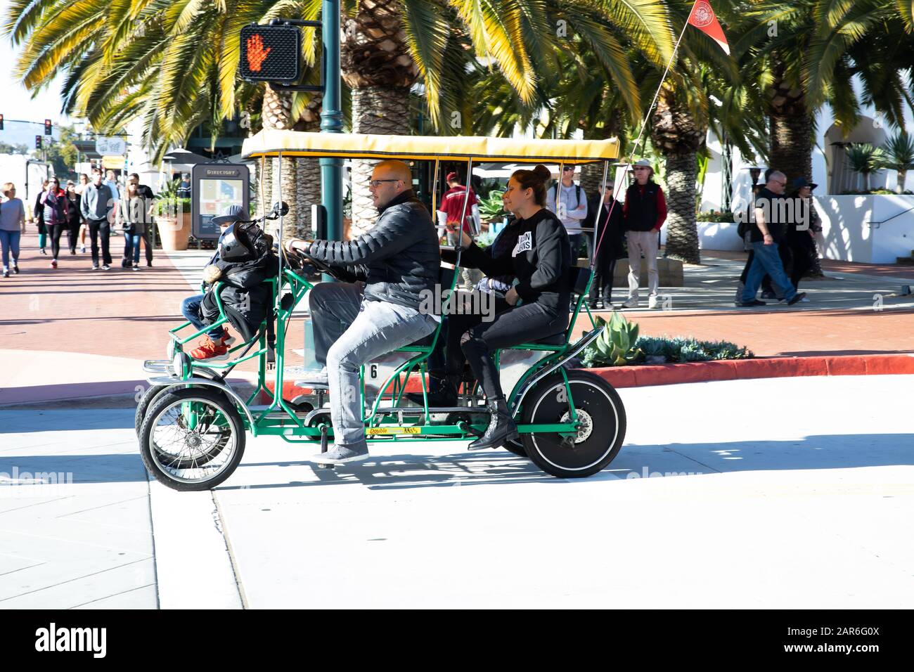 People enjoy touring the city in a Four wheeled hired bike in Santa ...